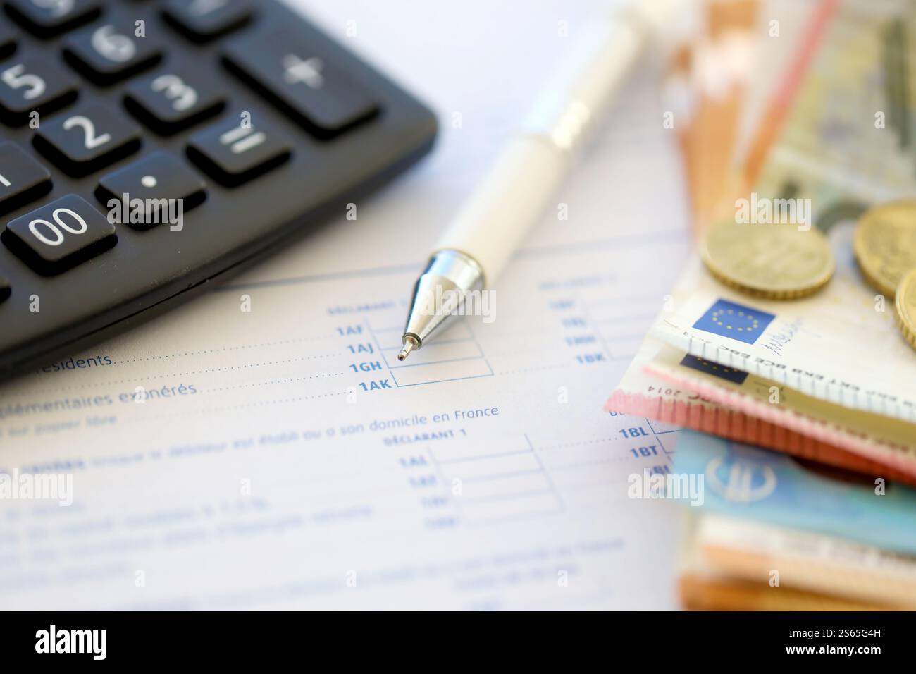 Filling french tax form process with calculator hi-res stock ...