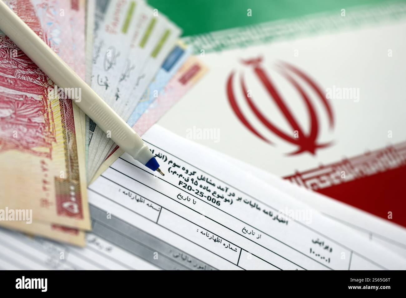 Iranian annual income tax return form F20-25-006 ready to fill on table ...