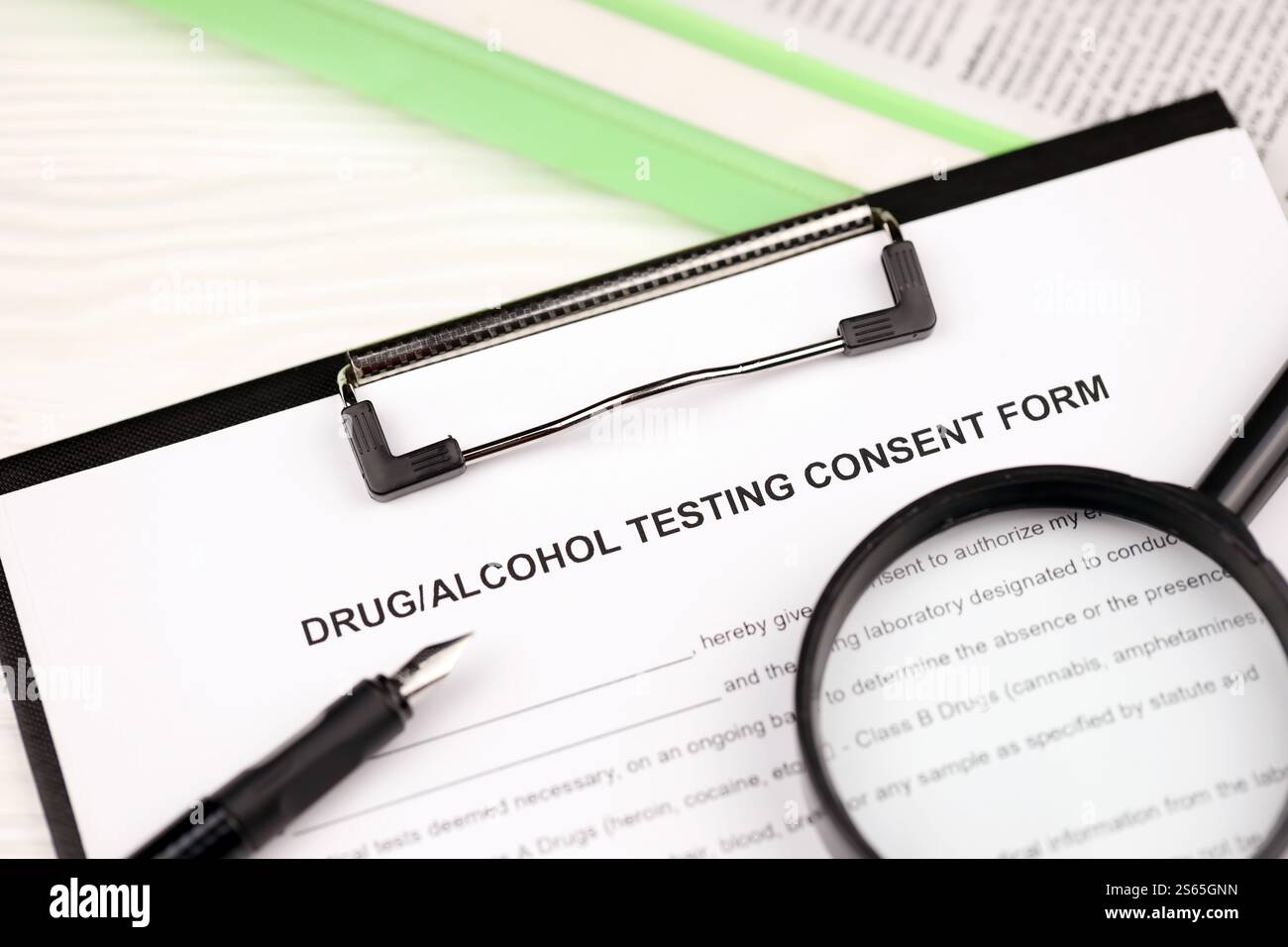Drug and alcohol testing consent form on A4 tablet lies on office table ...