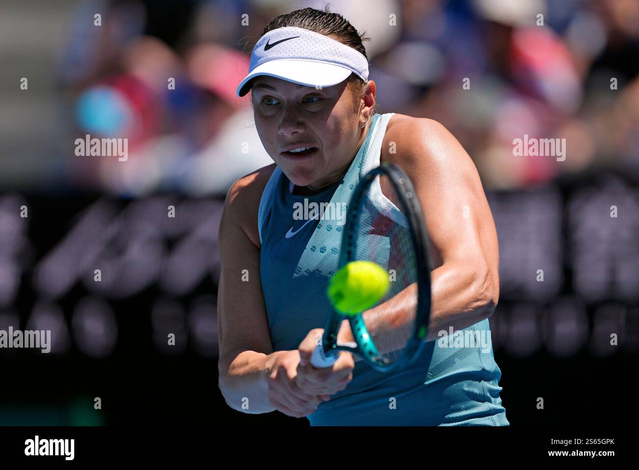 Amanda Anisimova of the U.S. plays a backhand return to Emma Raducanu ...