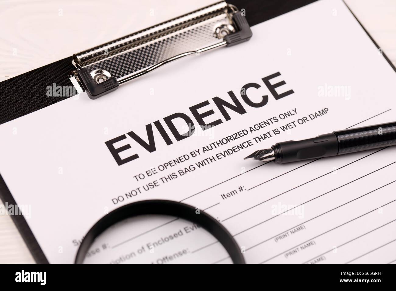 Evidence report blank on A4 tablet lies on office table with pen and ...