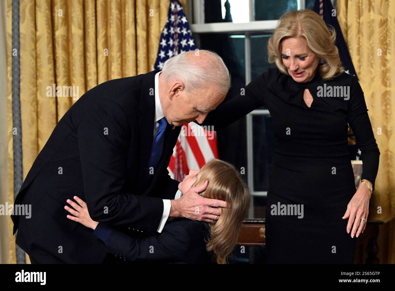 President Joe Biden hugs grandson Beau Biden as first lady Jill Biden ...