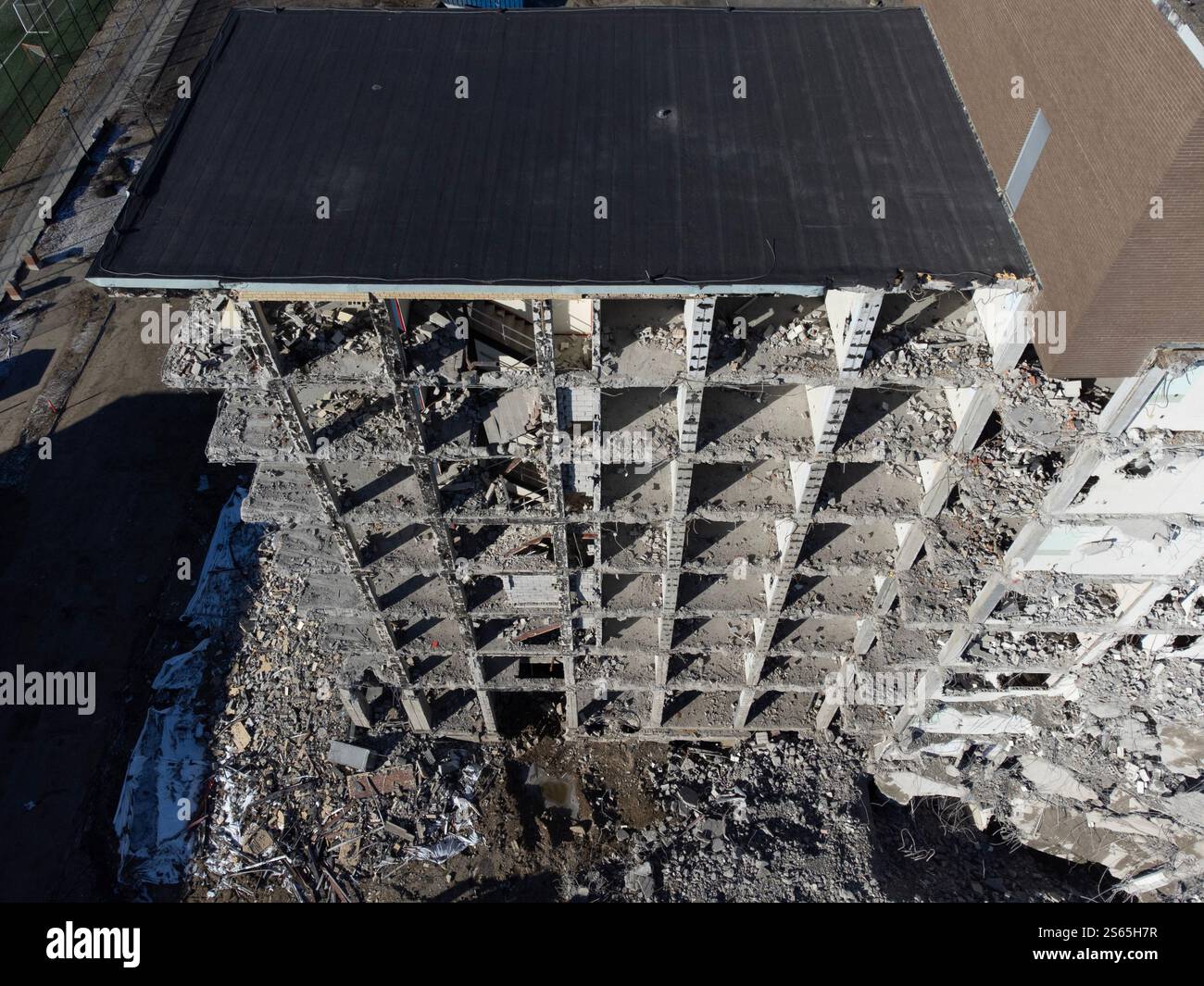 Looking down aerial view of a multistory concrete tower being ...