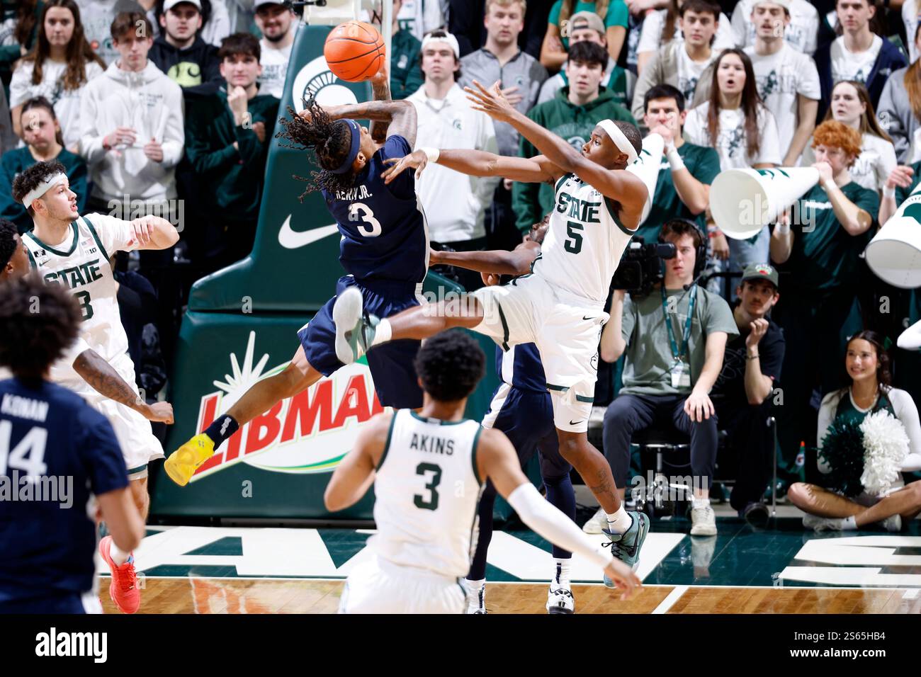 Michigan State guard Tre Holloman (5), right, and Penn State guard Nick ...