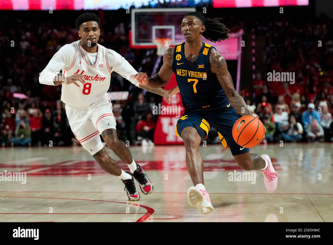 Houston guard Mylik Wilson (8) defends against West Virginia guard ...
