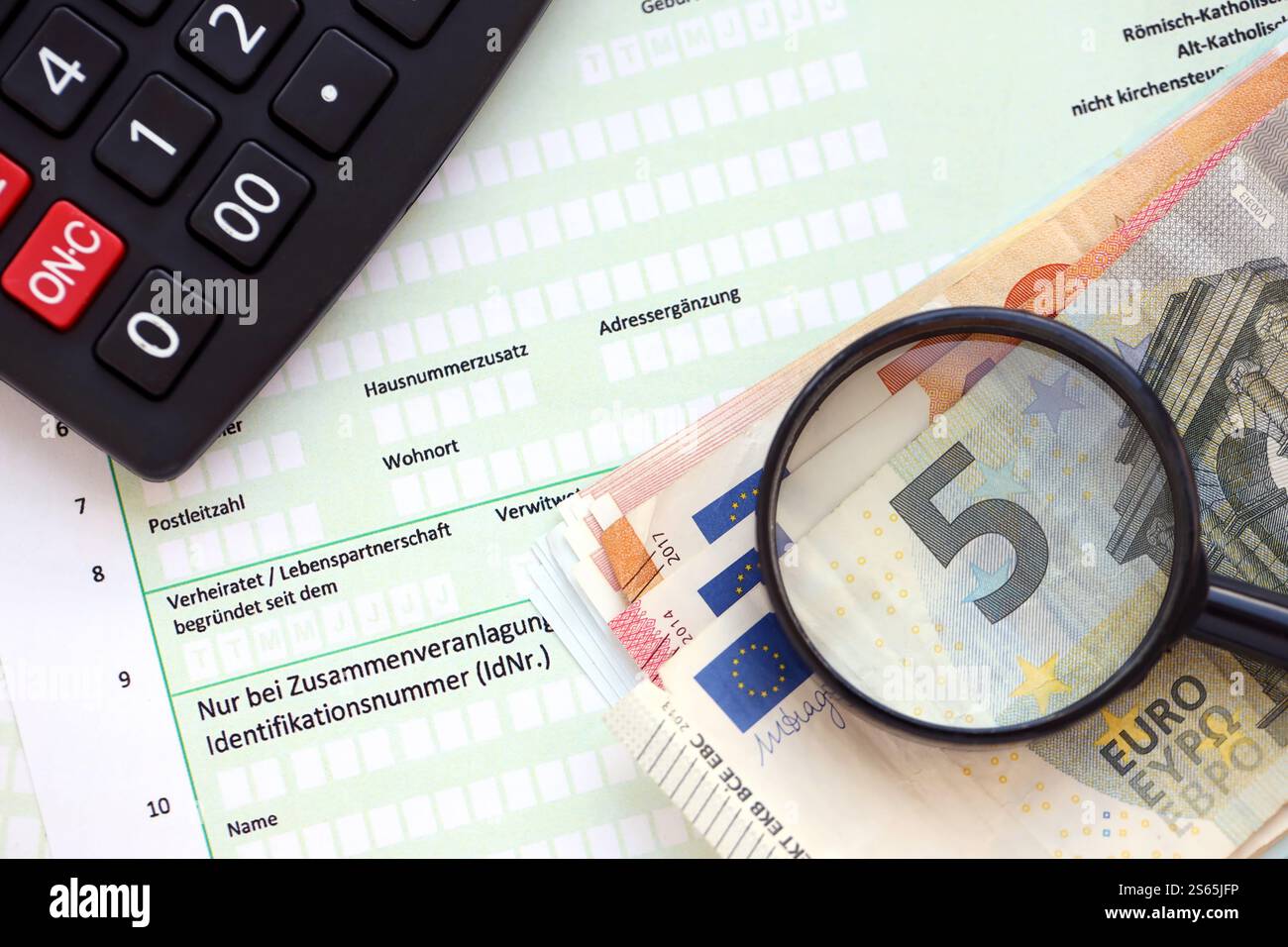German income tax return form with pen and european euro money bills ...