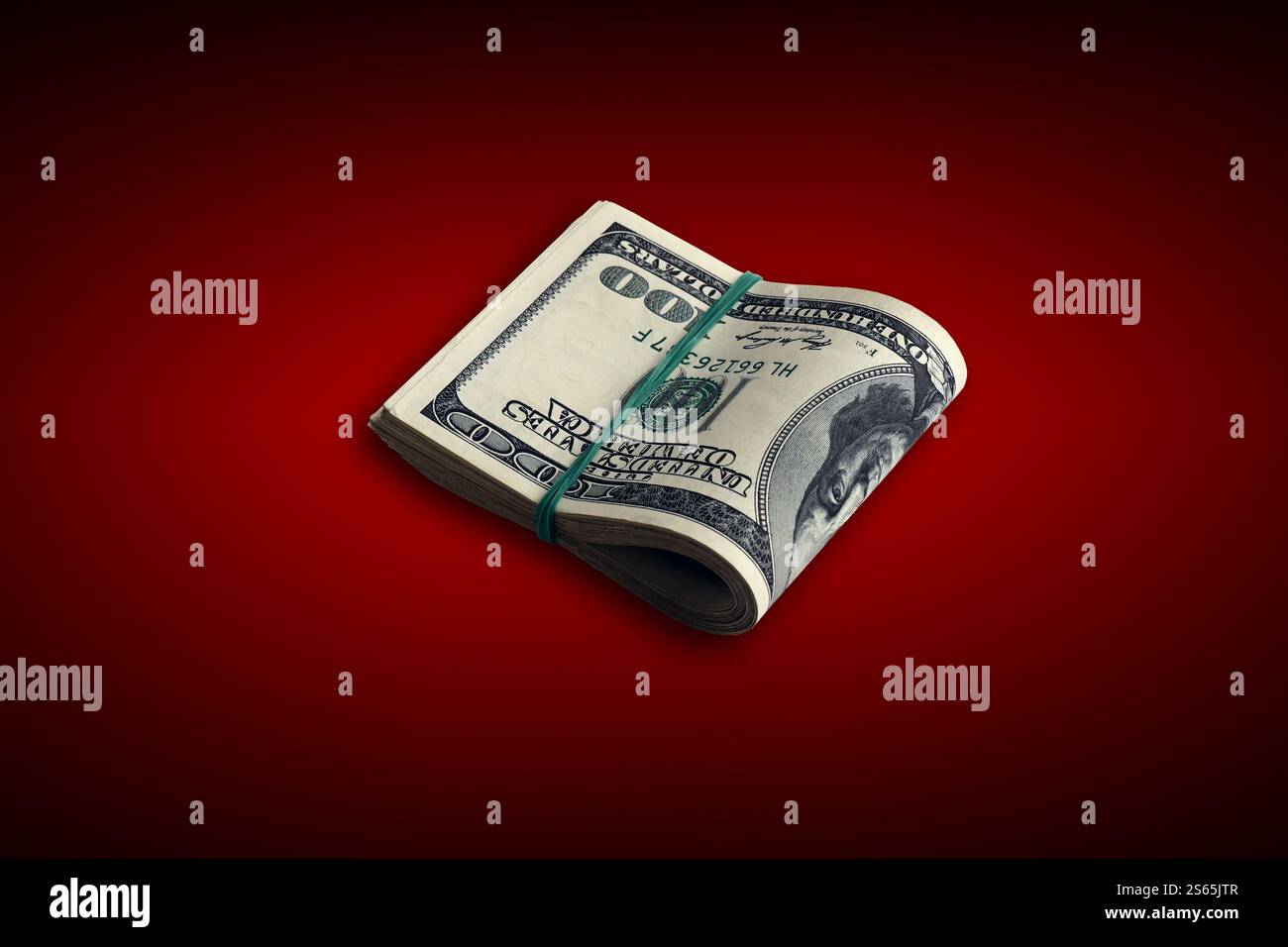 Bundle of US dollar bills on crimson red background. Pack of american ...