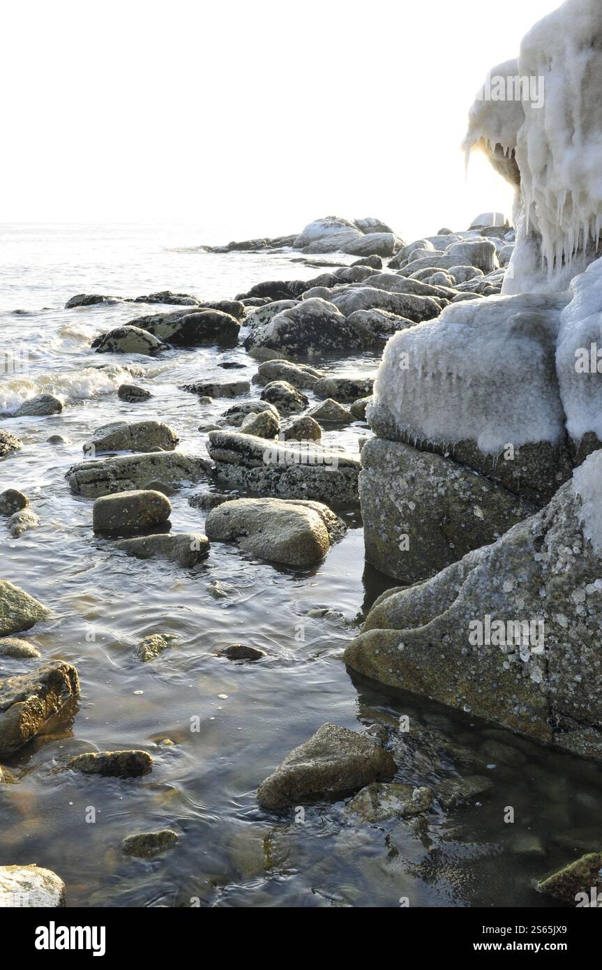 The winter sea ice and pebbles Stock Photo - Alamy