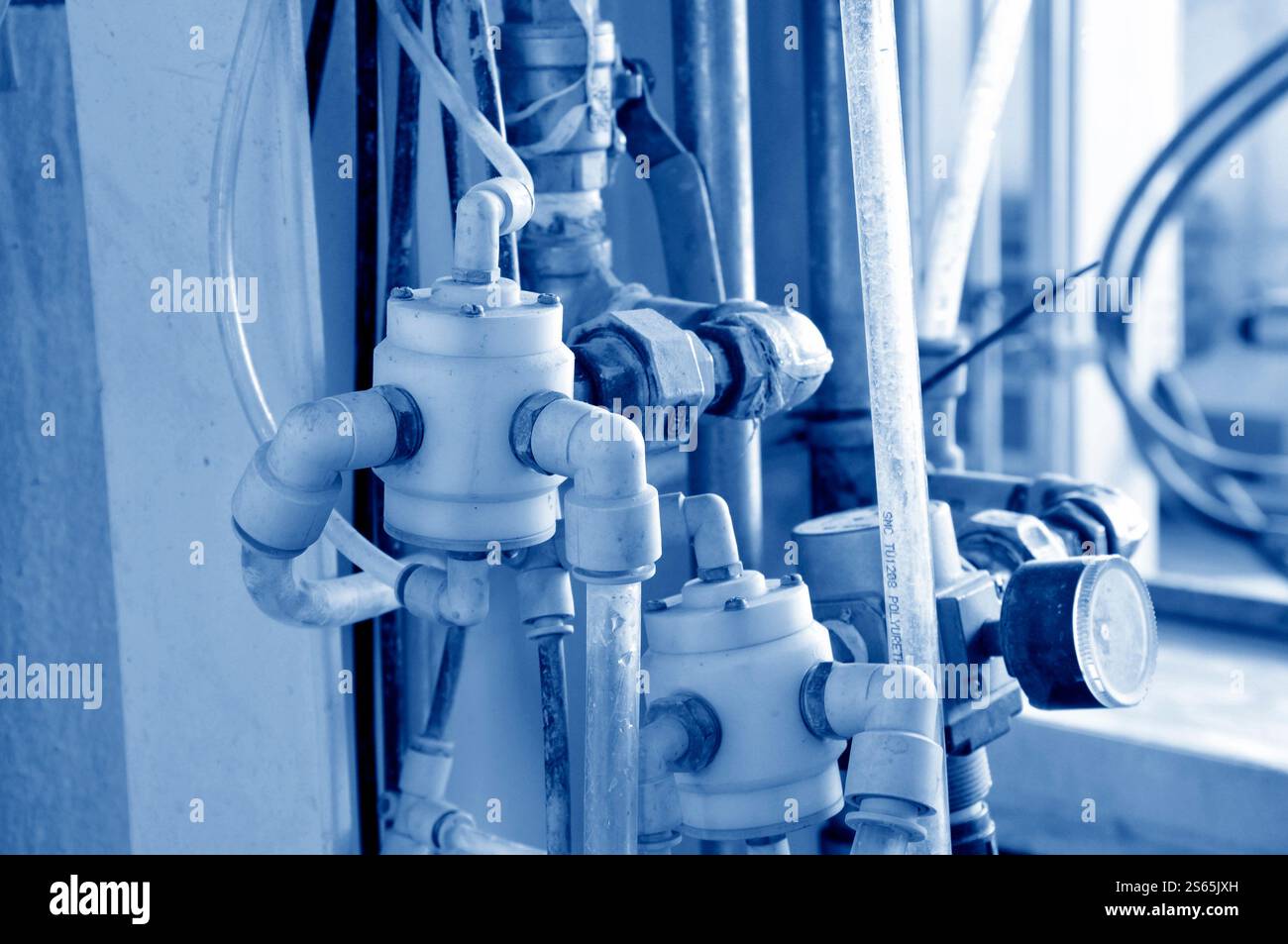 Shiny industrial equipment and piping, wiring and other connection ...