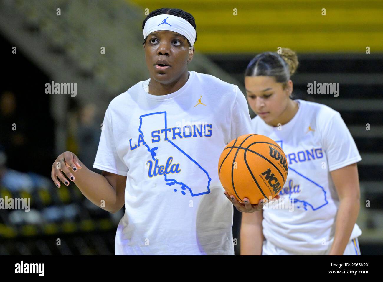 UCLA forward Zania Socka-Nguemen, wearing LA Strong t-shirt, warms up ...