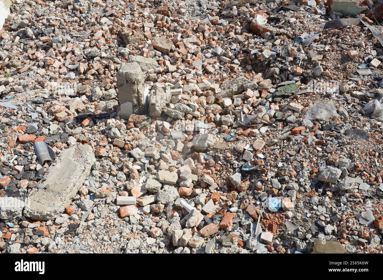 Pile of broken red bricks and fragments of concrete from destroyed ...