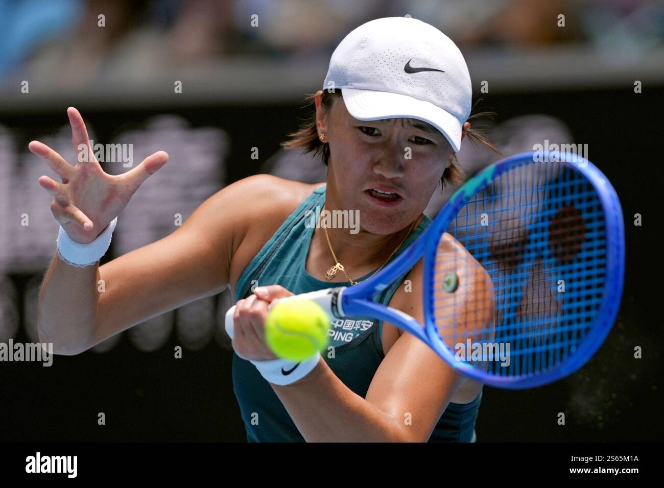 Wang Xiyu of China plays a forehand return to Emma Navarro of the U.S ...