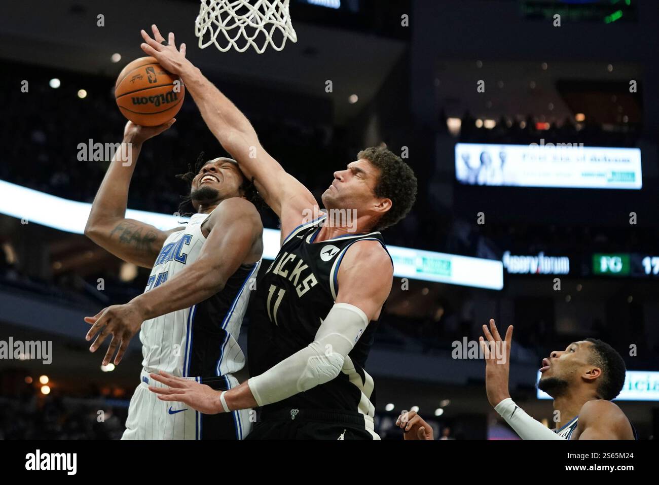 Orlando Magic's Wendell Carter Jr., left, attempts a shot against ...
