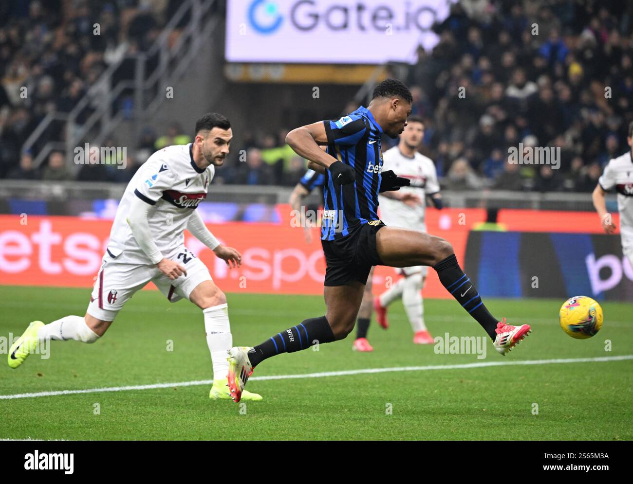 Milan. 15th Jan, 2025. Inter Milan's Denzel Dumfries (R) scores during ...
