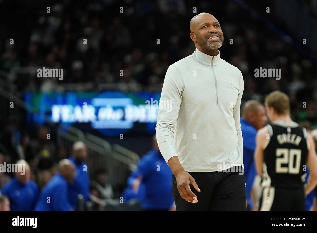 Orlando Magic head coach Jamahl Mosley looks off during a timeout ...