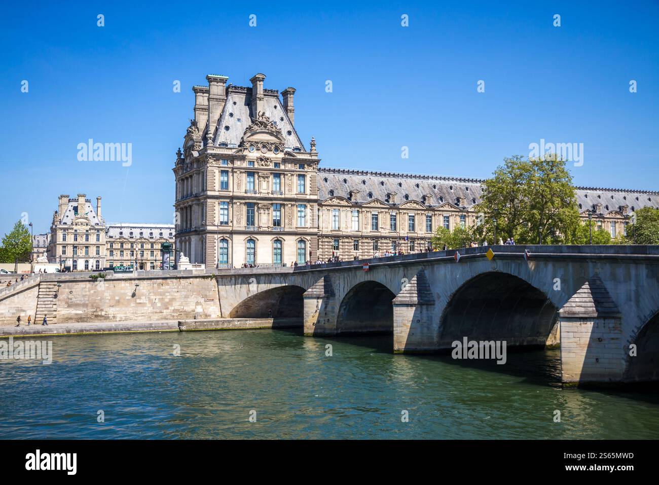 Louvre museum and Royal bridge view from the Seine river banks, Paris ...