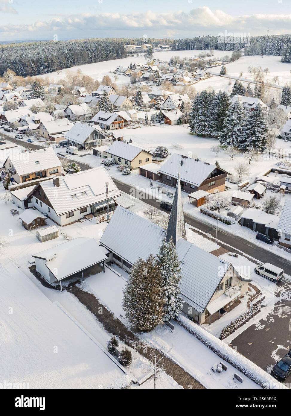 Snow-covered roofs and church in a wintry village, Oberreichenbach ...