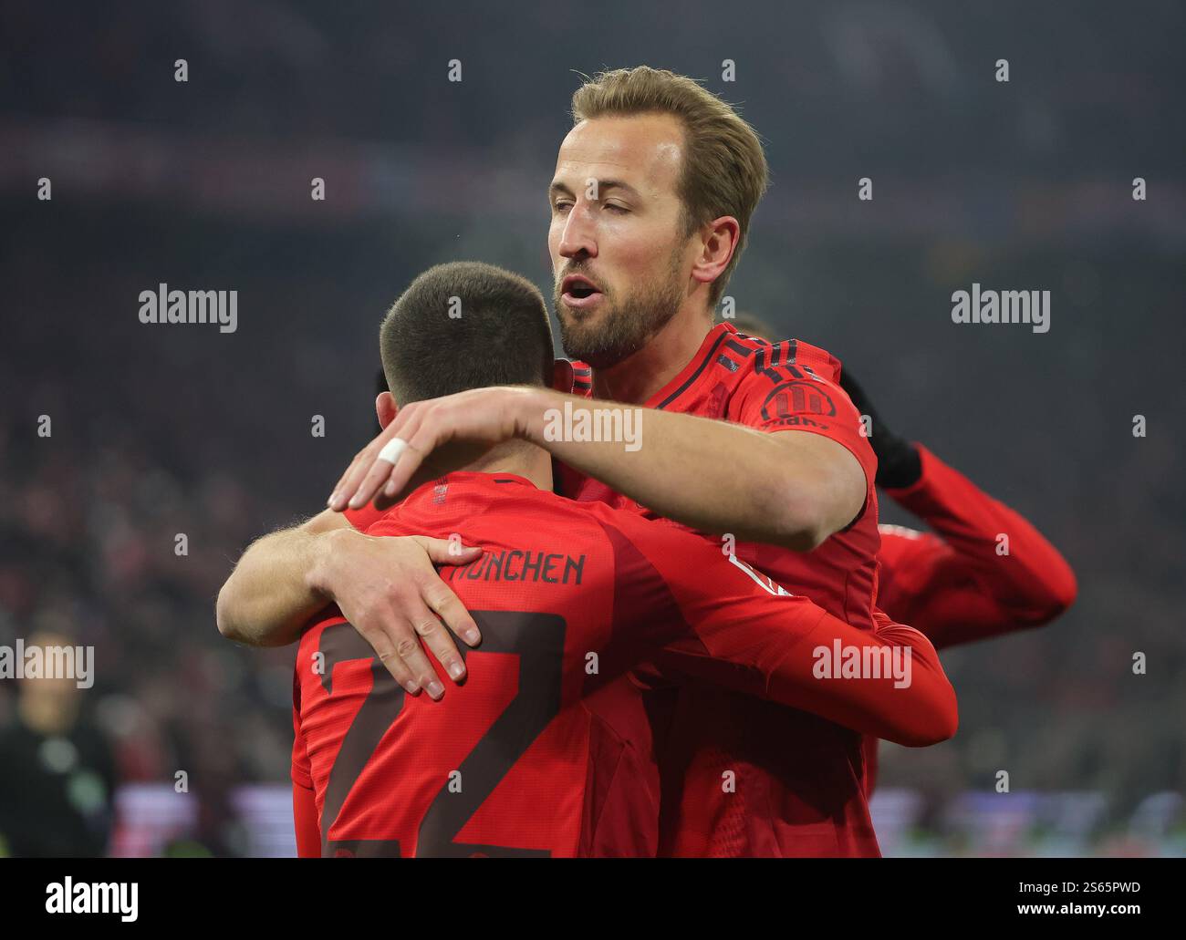 Munich, Germany. 15th Jan, 2025. Raphael Guerreiro (L) and Harry Kane ...