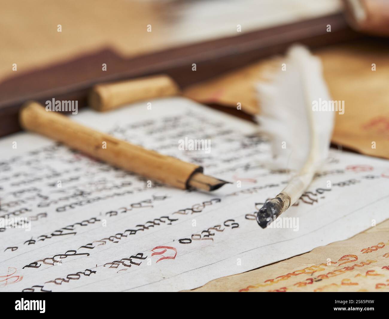 An ancient written scroll of parchment with an ancient pen Stock Photo ...