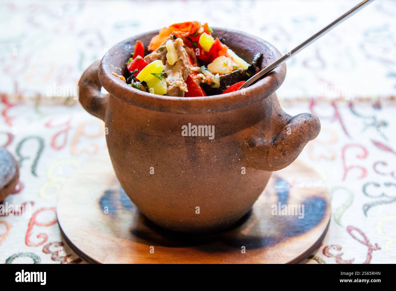 travel to Georgia - eating of Chanakhi (traditional Georgian dish of ...