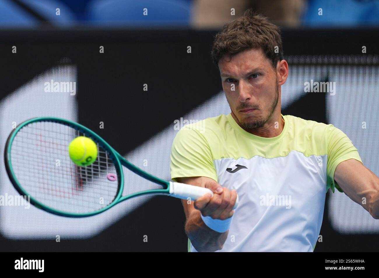 Pablo Carreno Busta of Spain plays a forehand return to Ben Shelton of ...