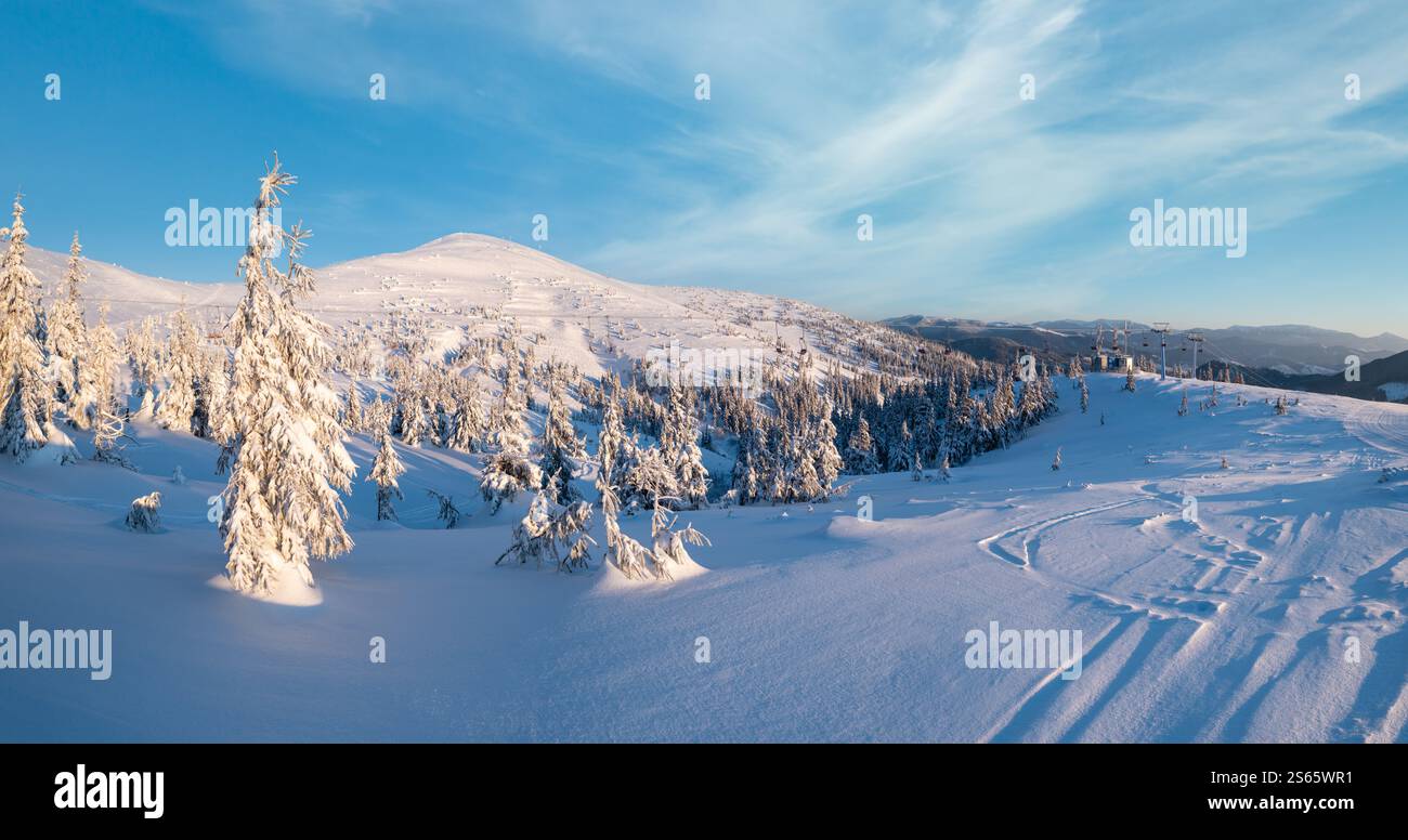 Alpine resortr ski lift with seats going over the sunrise mountain ...