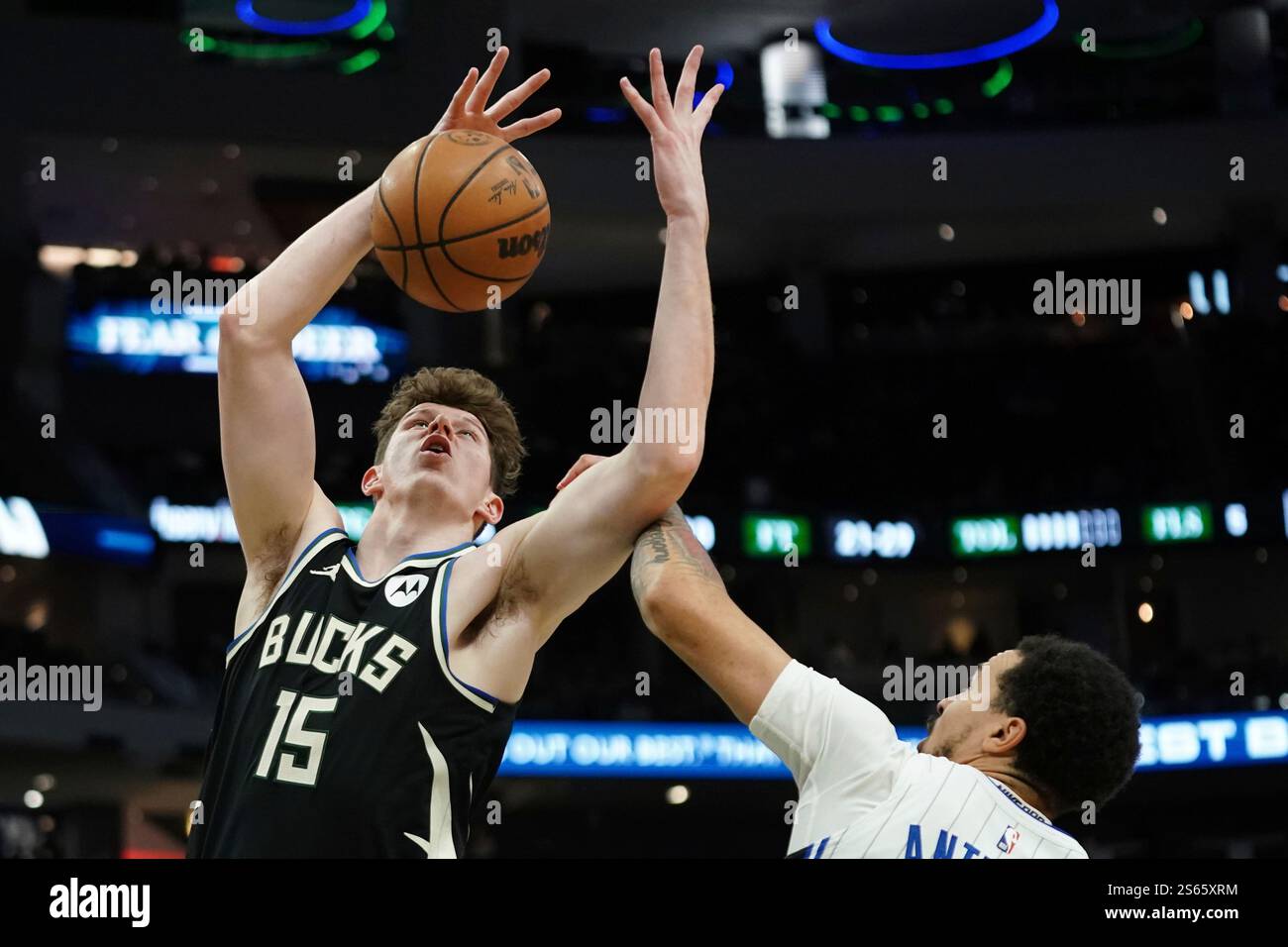 Milwaukee Bucks' Liam Robbins (15) is unable to control the ball ...