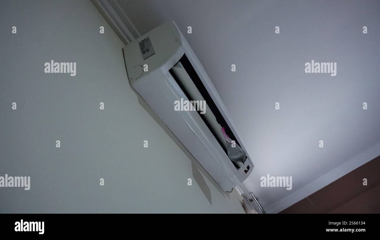 Wall mounted air conditioning unit with open front panel Stock Photo ...