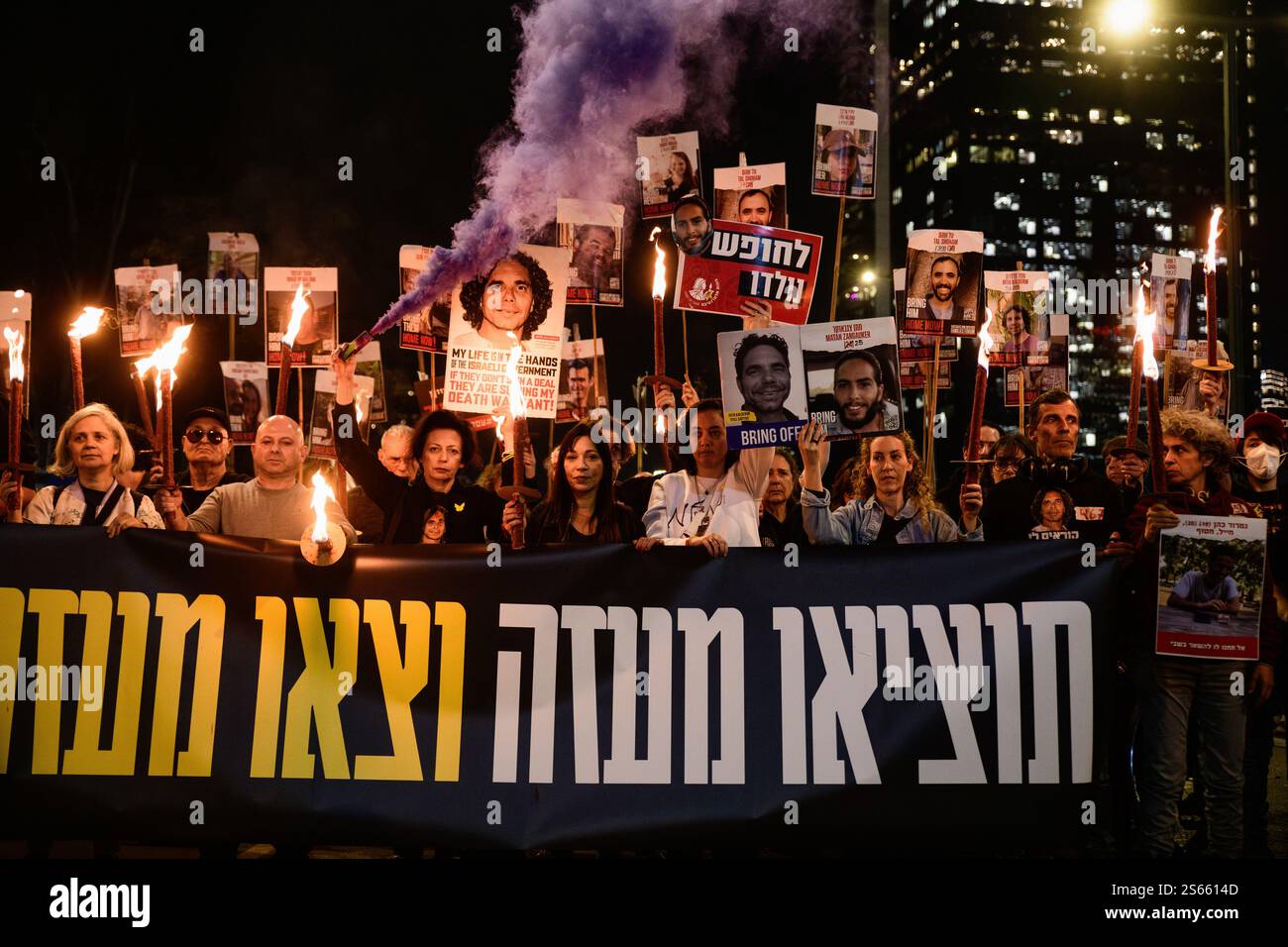 Ifat Kalderon, cousin of Israeli hostage Ofer Kalderon holds up a smoke ...