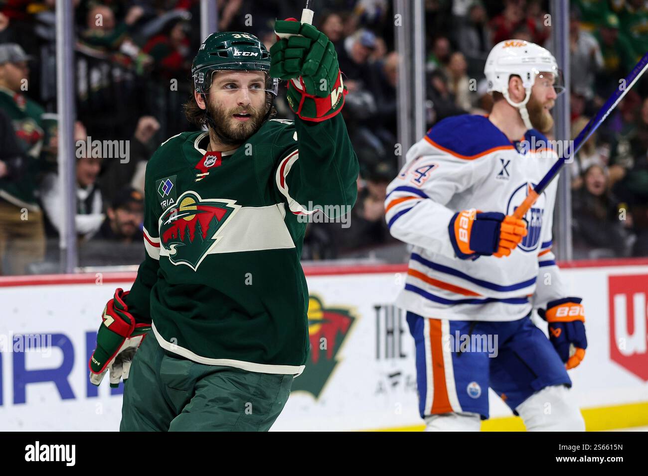 Minnesota Wild right wing Ryan Hartman, left, celebrates his goal as ...