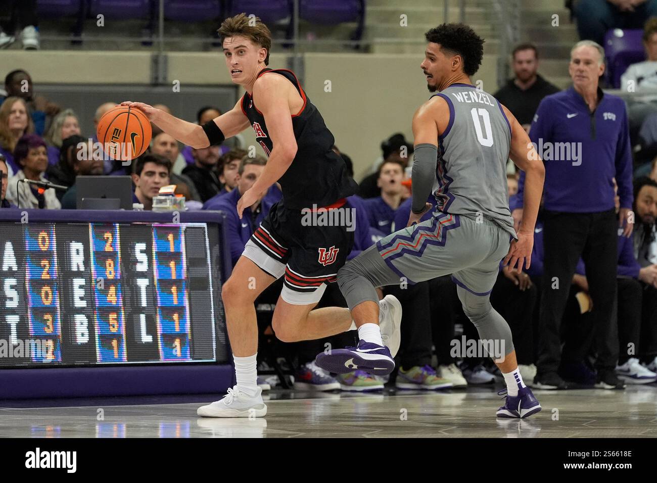 Utah forward Jake Wahlin (10) dribbles past TCU guard Brendan Wenzel (0 ...
