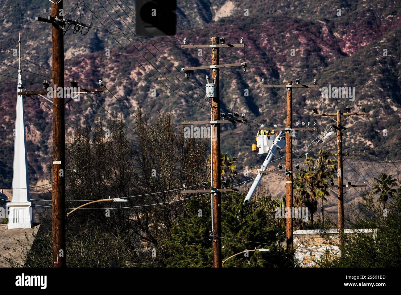 Crews work to re-establish power lines destroyed by the Eaton Fire ...