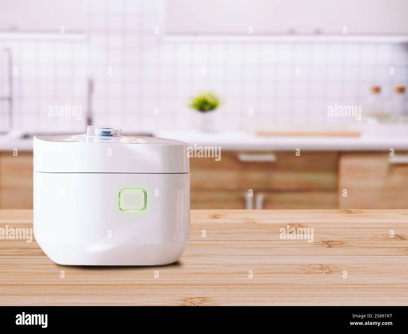 A minimalist white rice cooker filled with steaming rice, situated in a ...