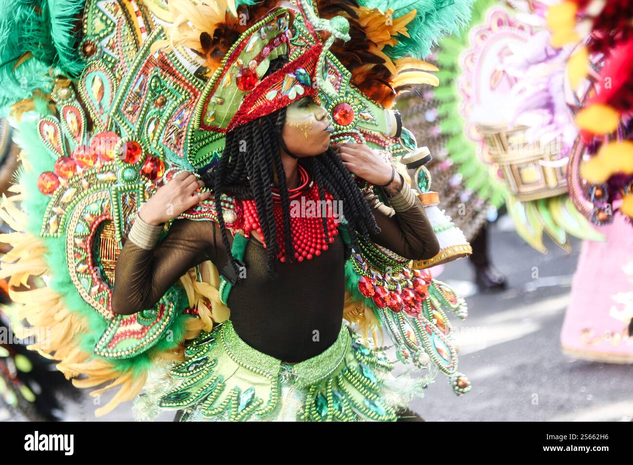 A beautiful lady in a green costume dancing in the New Year s Day ...