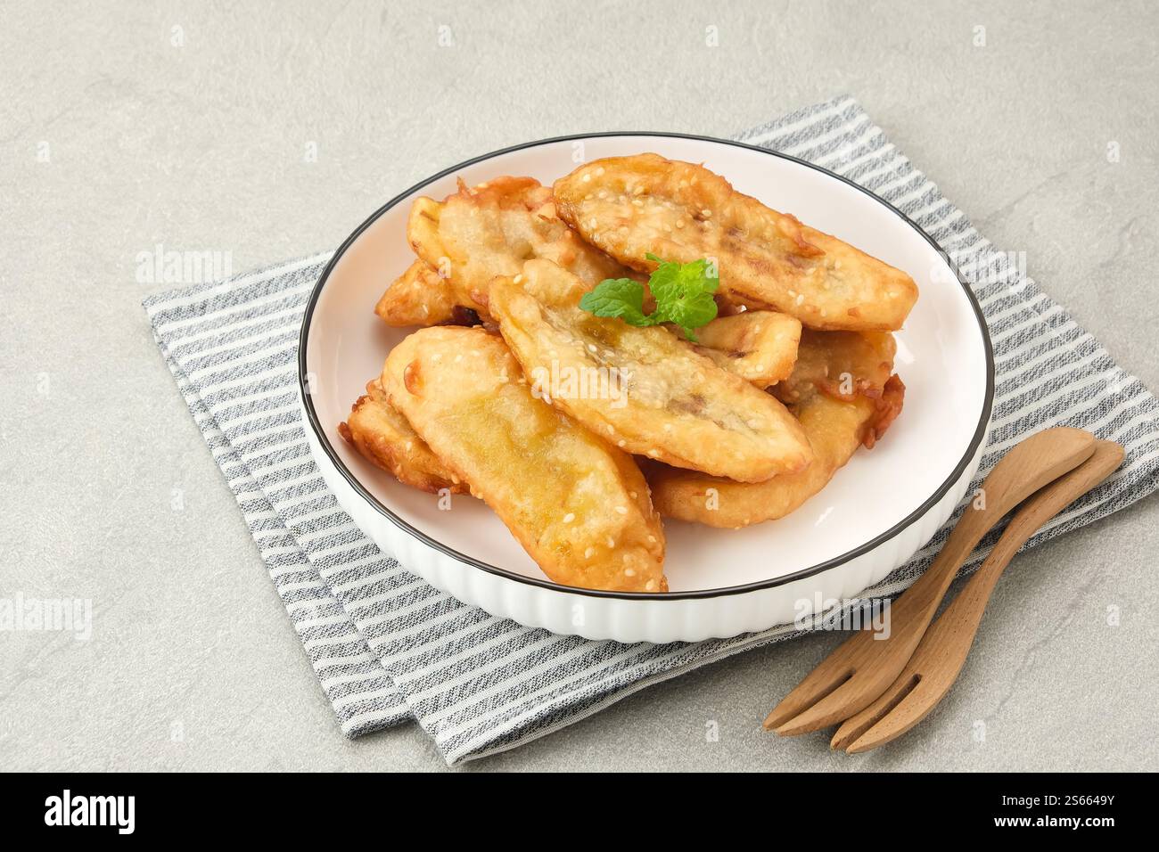 Pisang goreng or banana fritters (deep fried banana fritter with flour ...