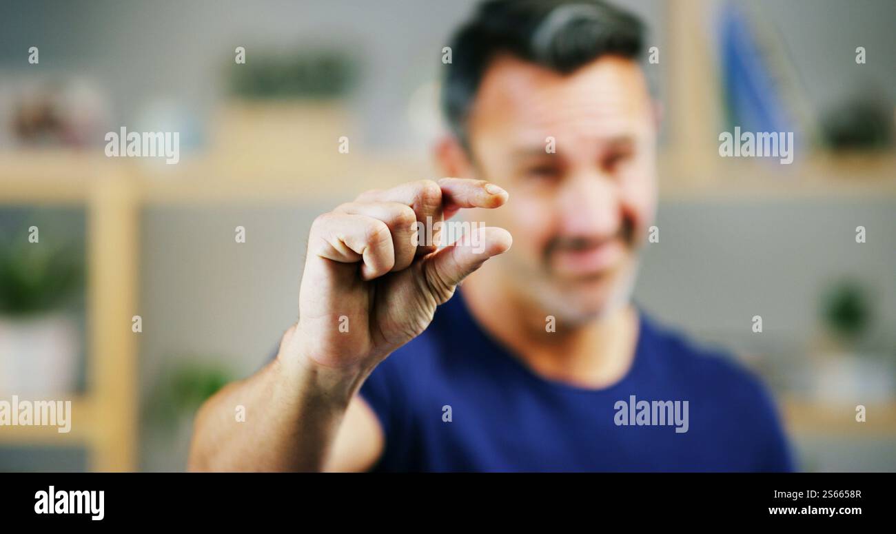 Man, hands and sign for small size, measurement or emoji in creative ...