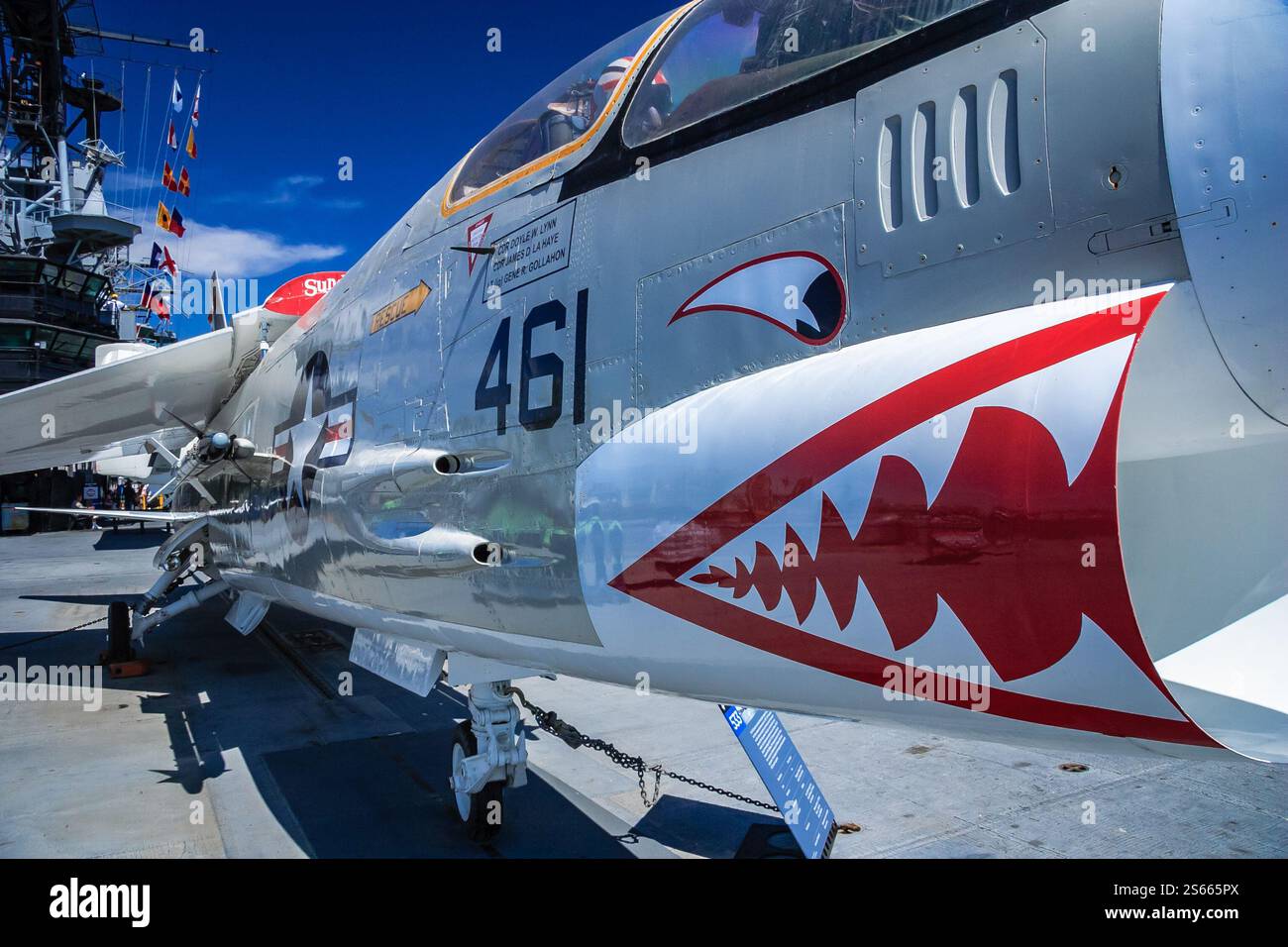A fighter jet with the number 461 on the side. The jet has a red and ...