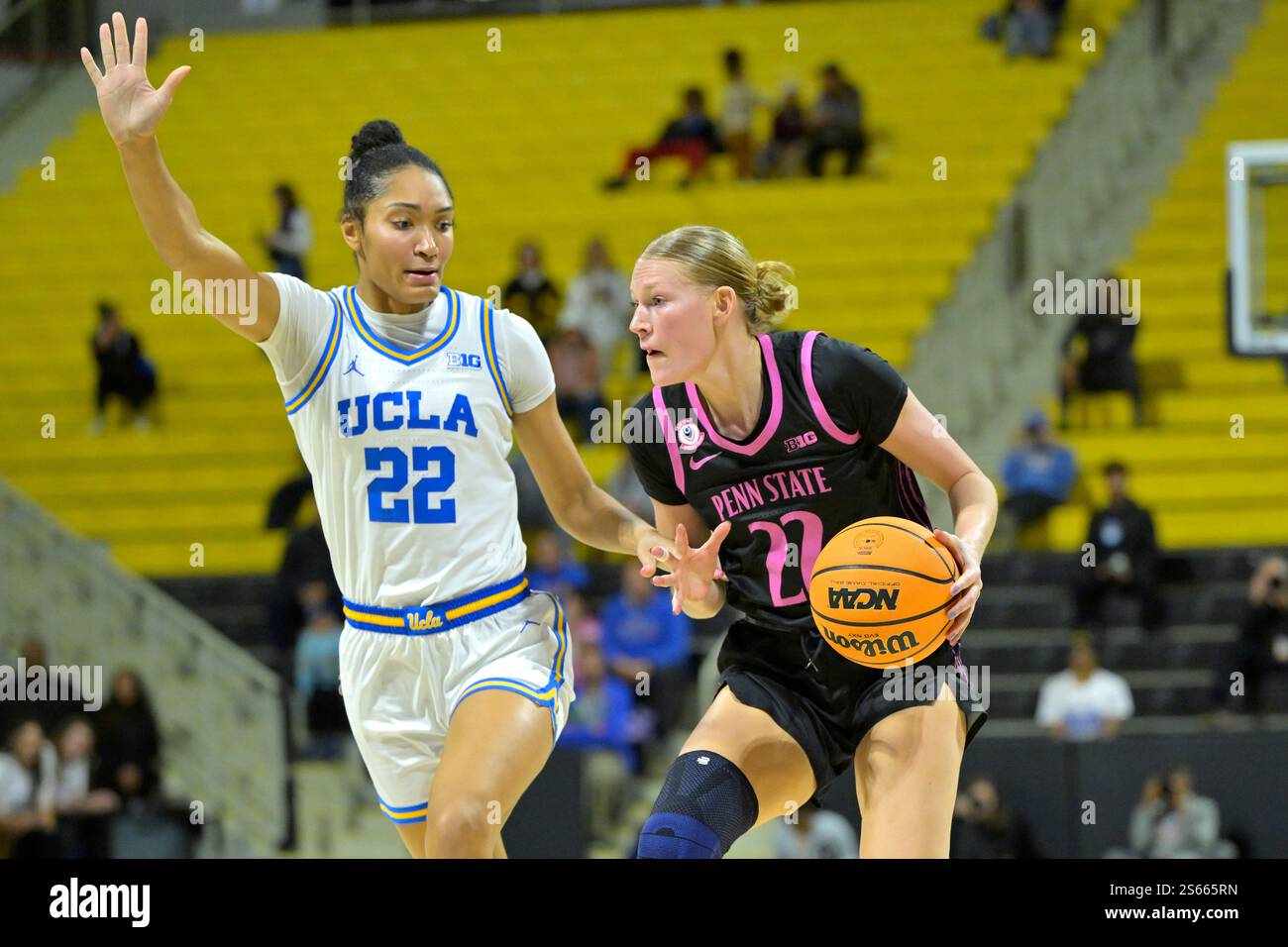 UCLA forward Kendall Dudley (22) defends Penn State guard Alli Campbell ...