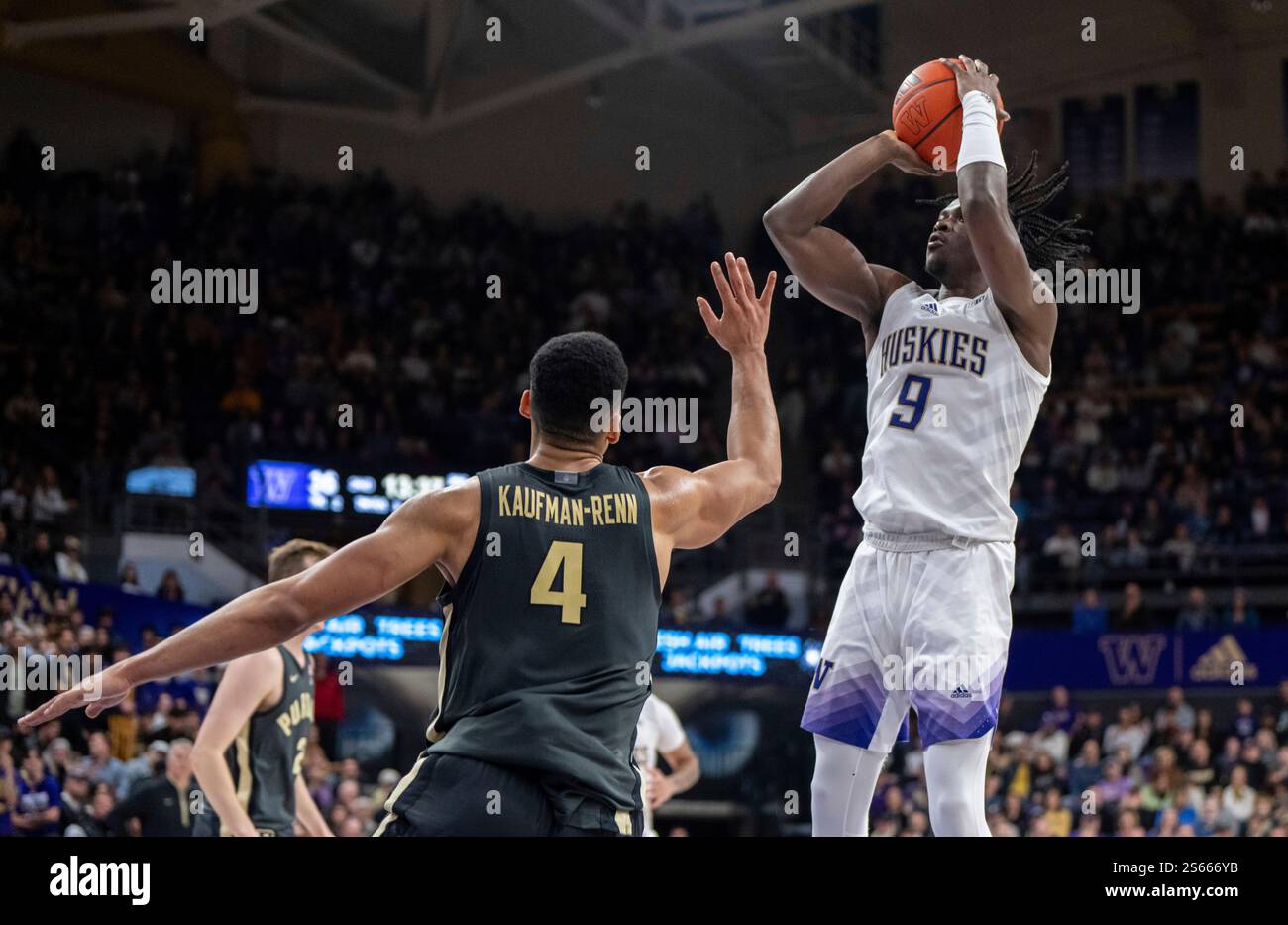 Washington guard Vazoumana Diallo, right, shoots the ball against ...