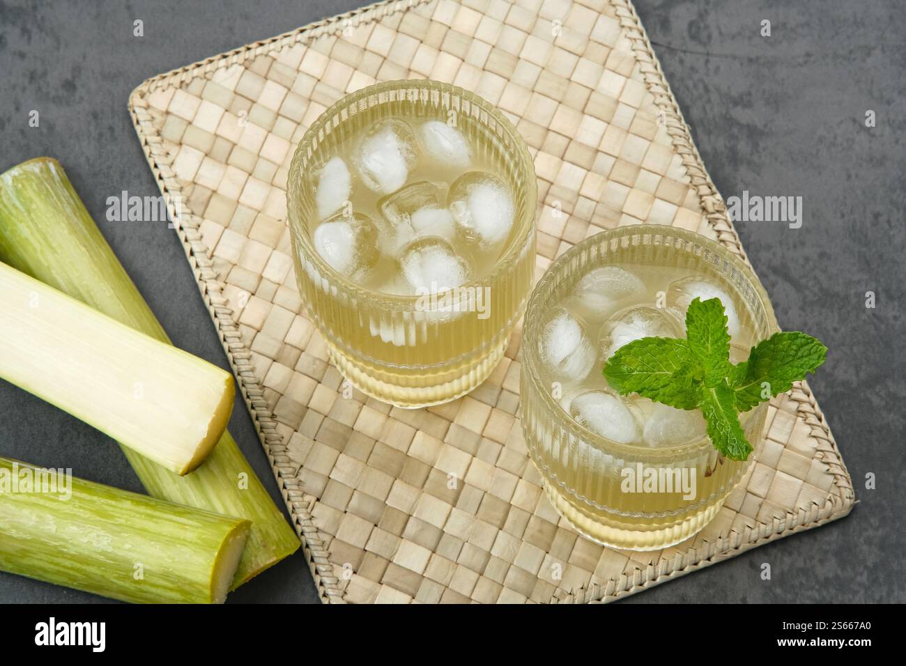 Fresh sugar cane juice (Es Tebu) in glass. Indonesian drink Stock Photo ...