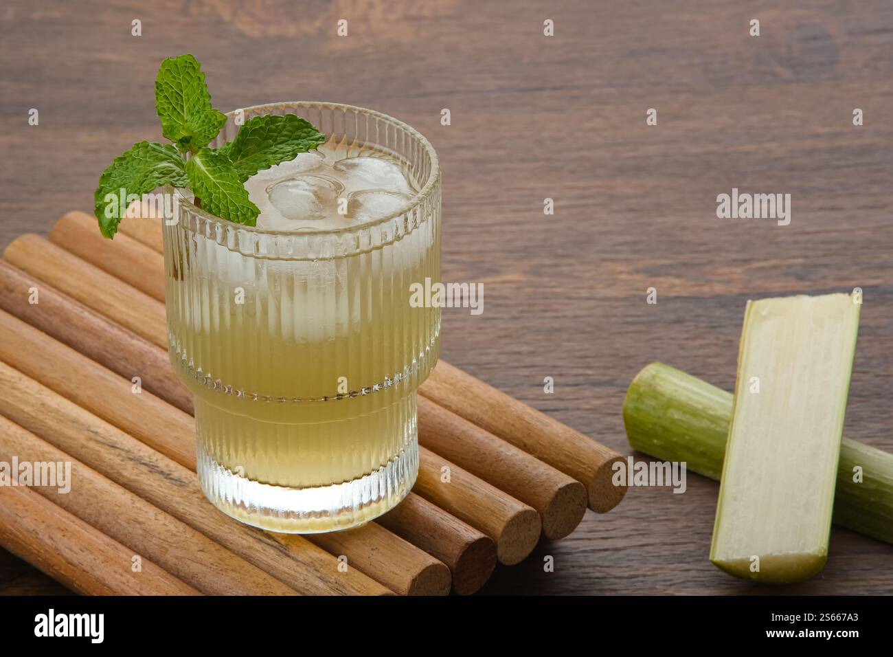 Fresh sugar cane juice (Es Tebu) in glass. Indonesian drink Stock Photo ...