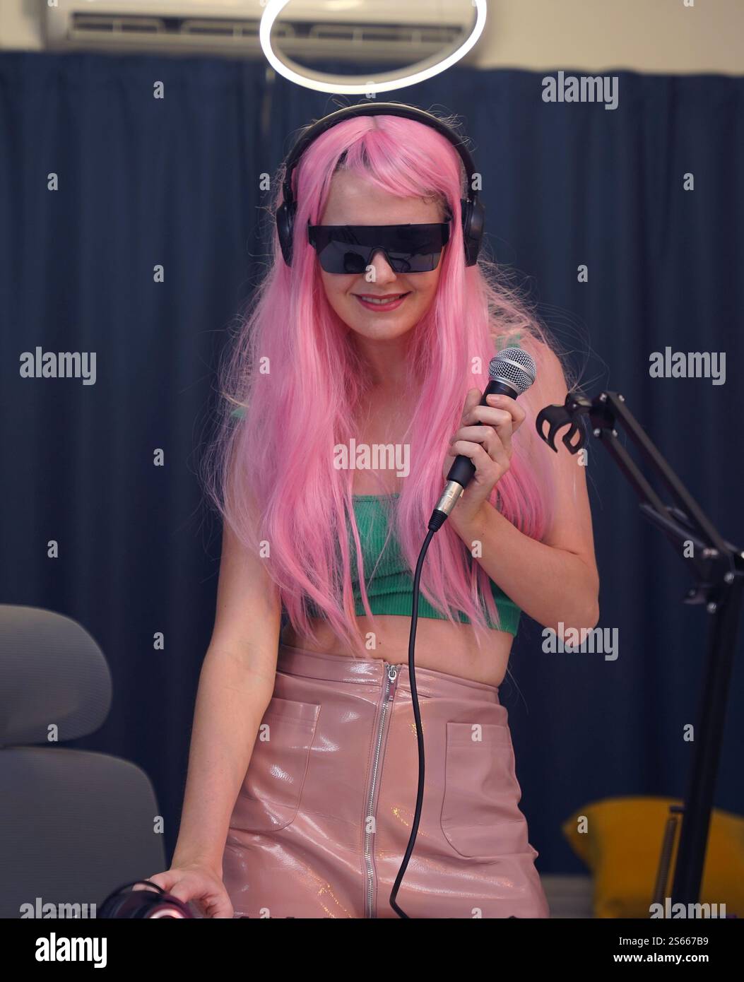Beautiful young singer and musician broadcast from her home studio ...