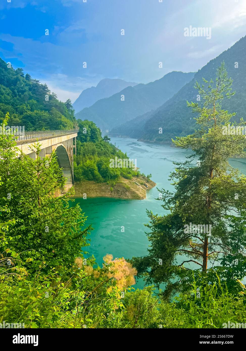 Valvestino lake and Recchi bridge on summer rainy day, Italy Stock ...