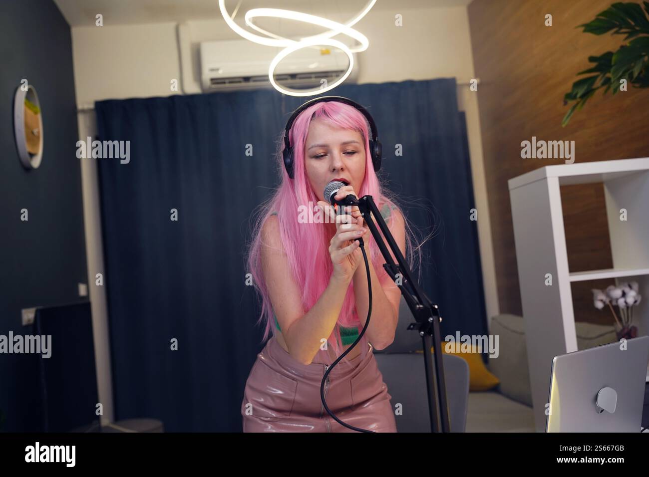 Beautiful young singer and musician broadcast from her home studio ...