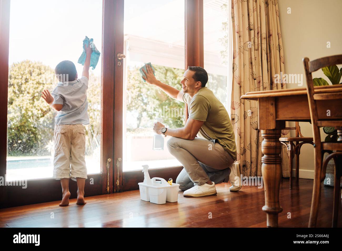 Home, father and child with cleaning windows for household chores ...