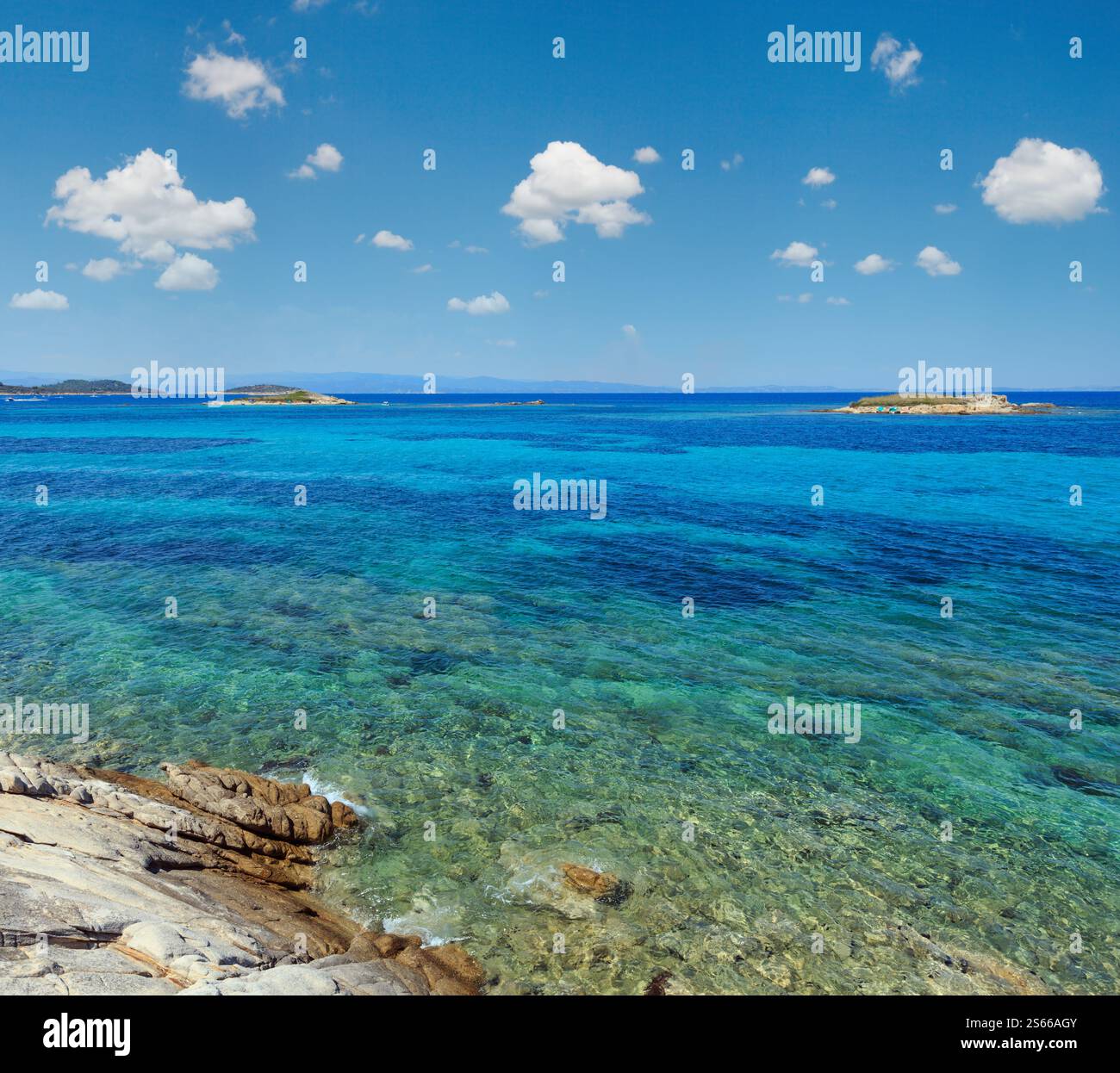 Aegean sea coast landscape with rocky island, view near Karidi beach ...