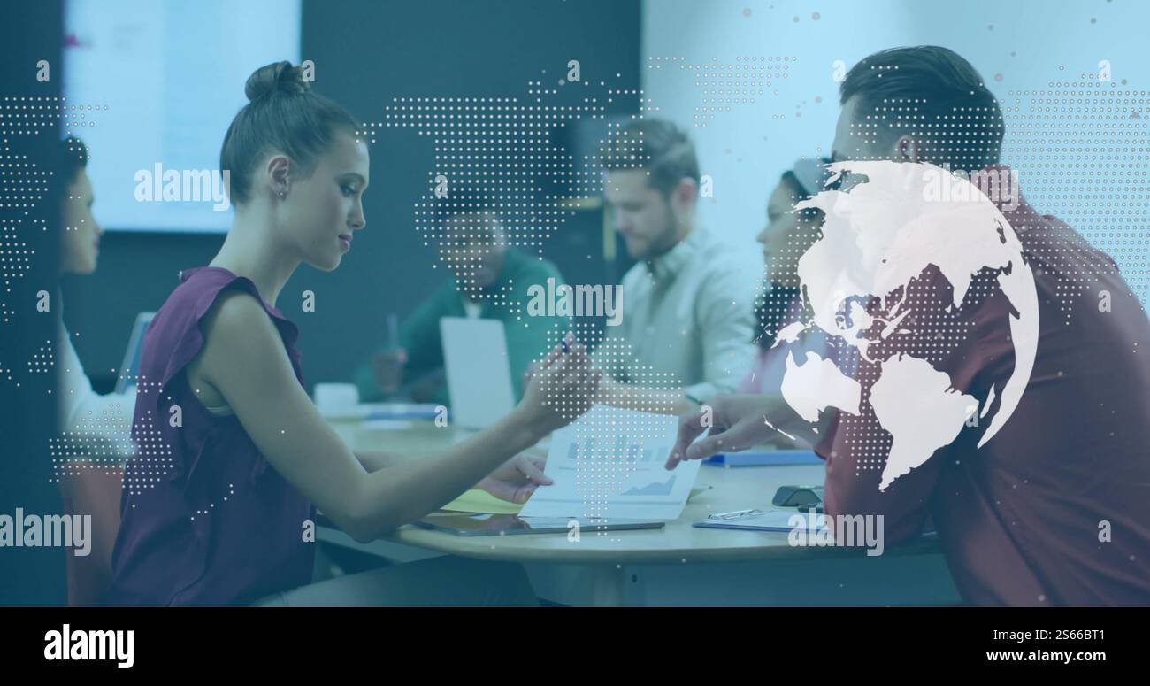 Image of world map and globe over diverse male and female colleagues at ...