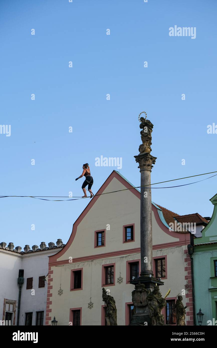 Female Slackliner Performing Above Historic Square Stock Photo - Alamy