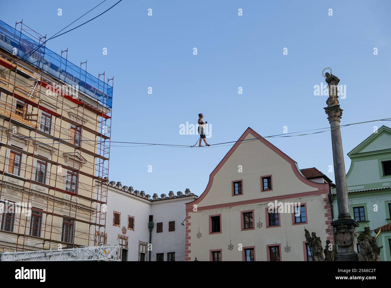 Female Slackliner Performing Above Historic Square Stock Photo - Alamy