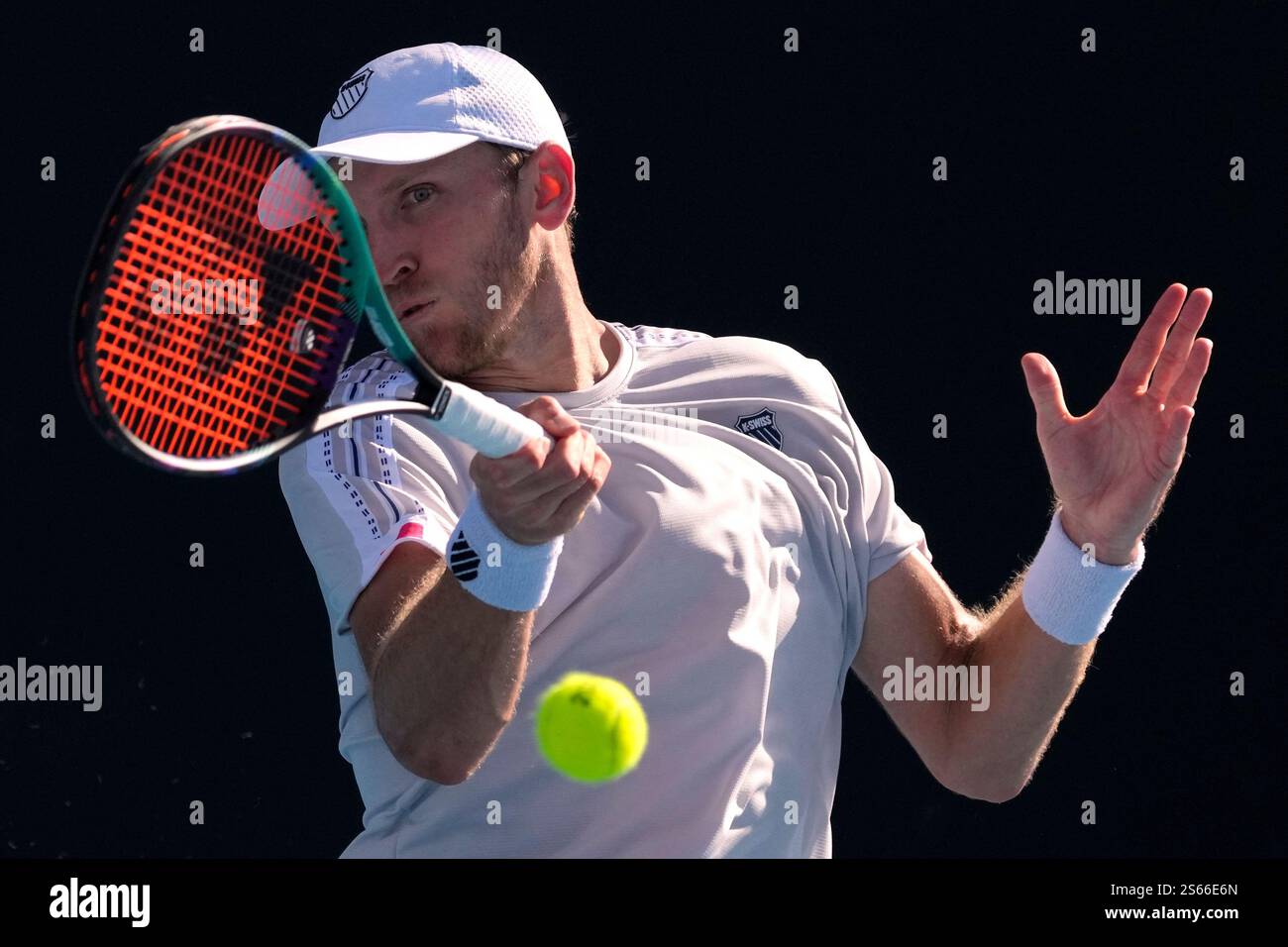 Mitchell Krueger of the U.S. plays a forehand return to Corentin Moutet ...